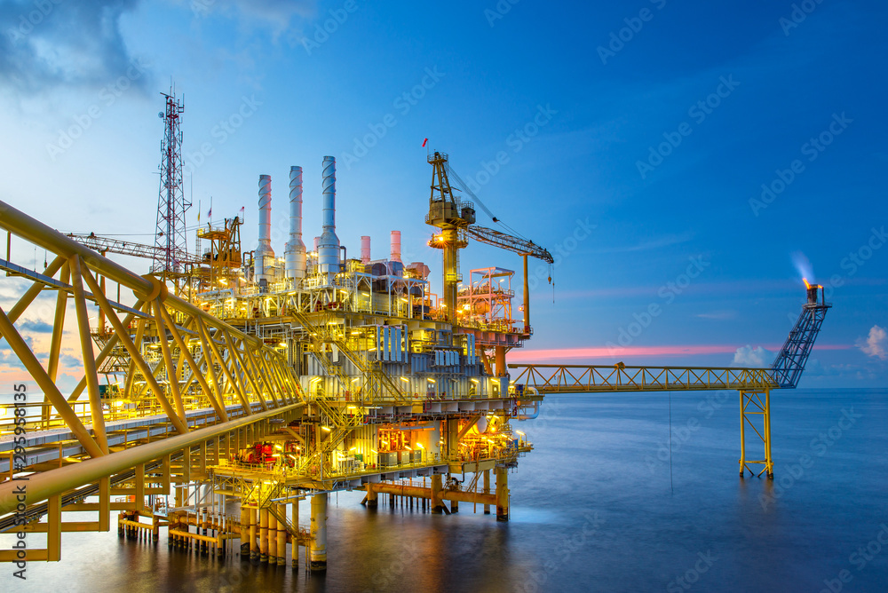 Offshore oil and gas platforms are in the process of releasing gas to ...