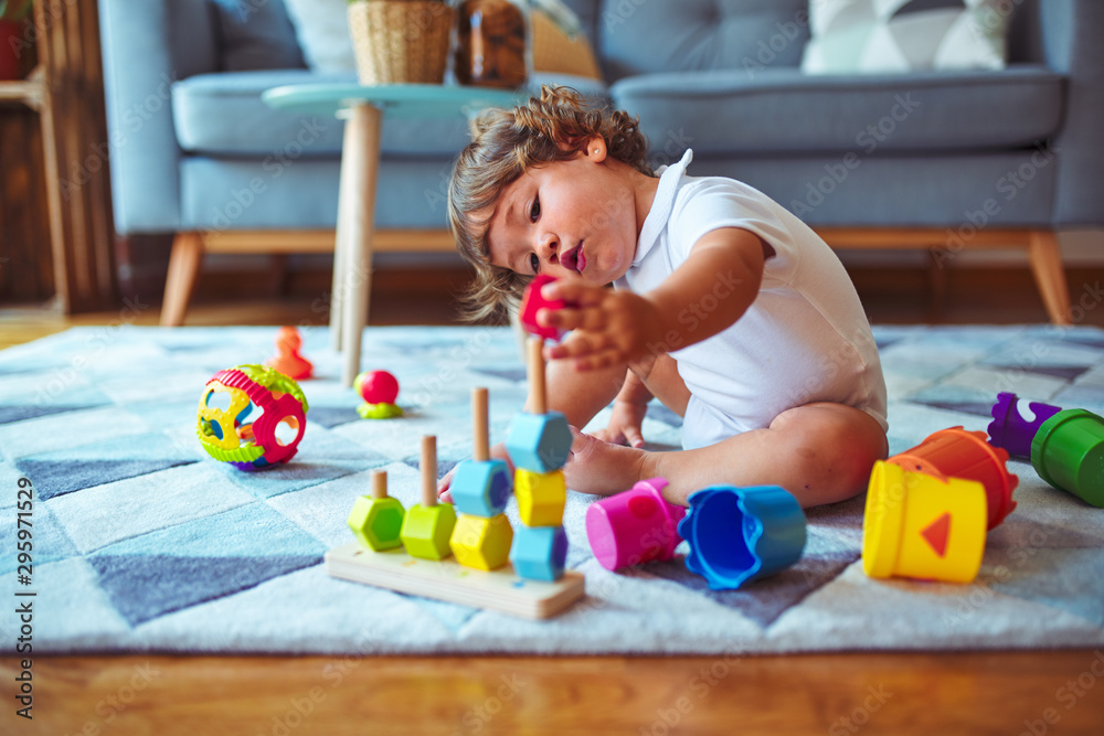 Fotografia do Stock: Beautiful toddler child girl playing with toys on ...