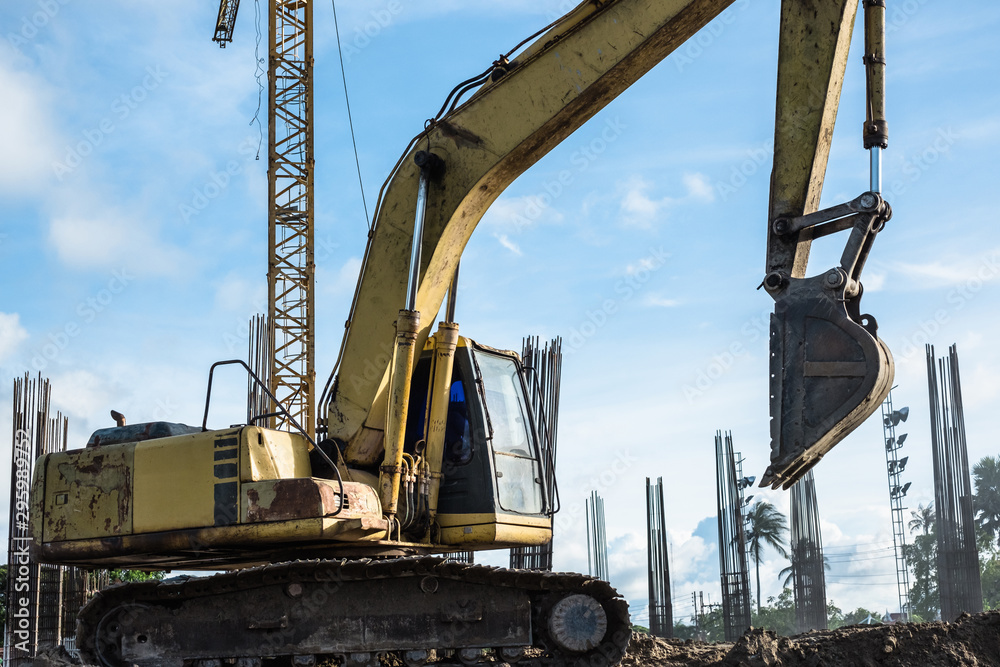 Foto de Old yellow backhoe or excavator work digging soil at new ...