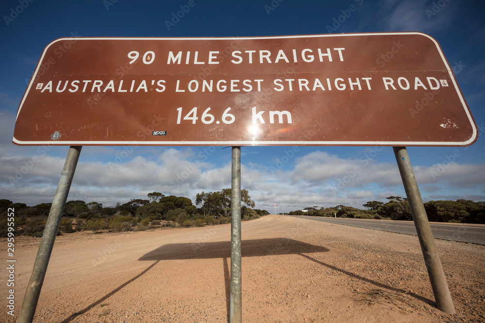 Sign denoting the start of the 90 mile straight road, which is ...