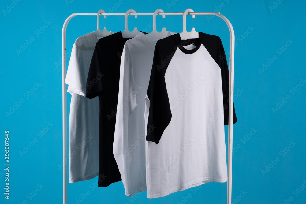 T shirt display on hanger isolated on background. Plain t shirt display ...