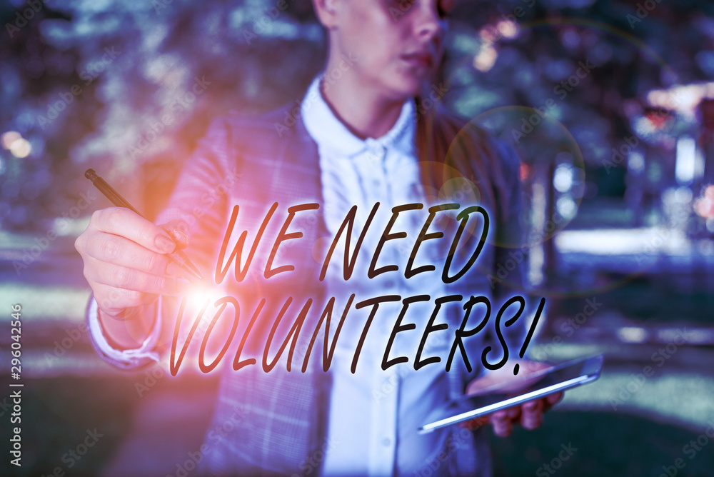 Text sign showing We Need Volunteers. Business photo text someone who ...