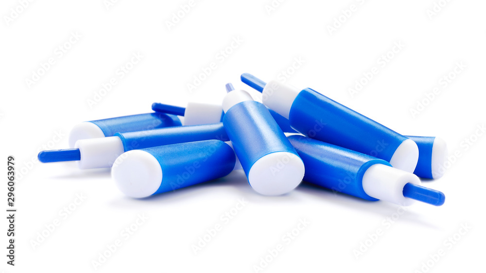 Blue lancets on a white background. Stack of blue lancets for a ...