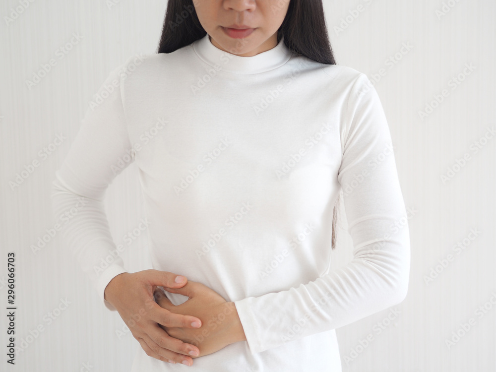 muscle pain in asian woman and she use hand touching and press her ...