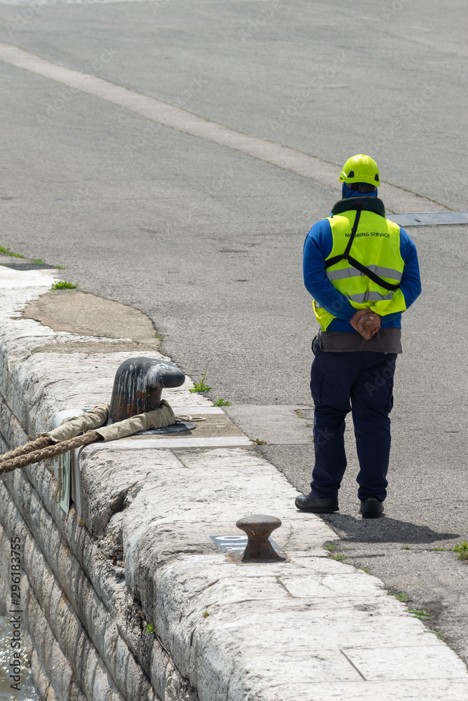 Mooring operation - man with mooring rope Stock Photo | Adobe Stock
