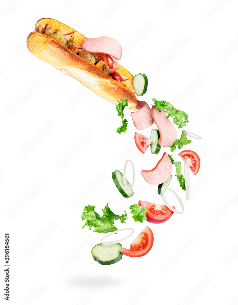 Ingredients are falling from a sandwich in the air on white background ...