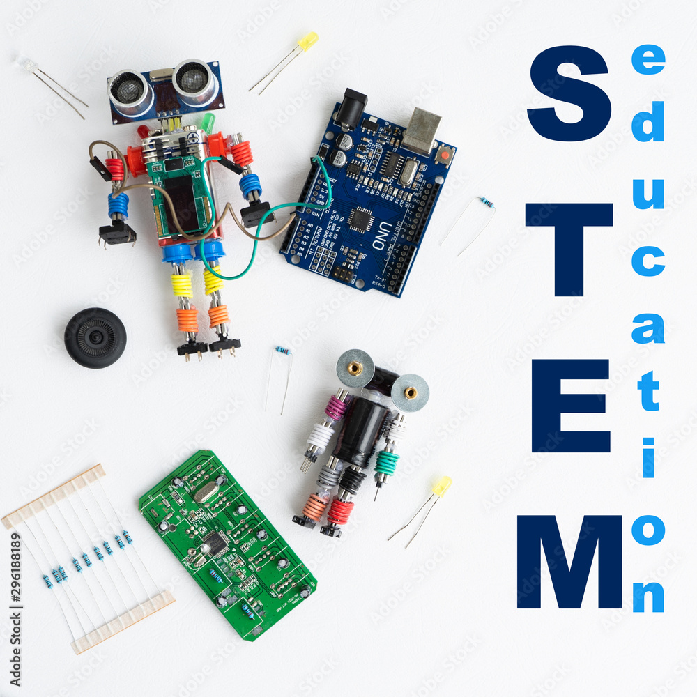 STEM school concept. A metal robot and an electronic board that can be ...
