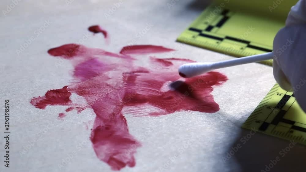 Macro shot of forensic csi police officer collecting blood sample with ...