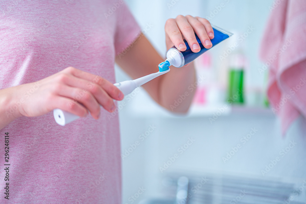 Brushing teeth using ultrasonic electric toothbrush and toothpaste in ...