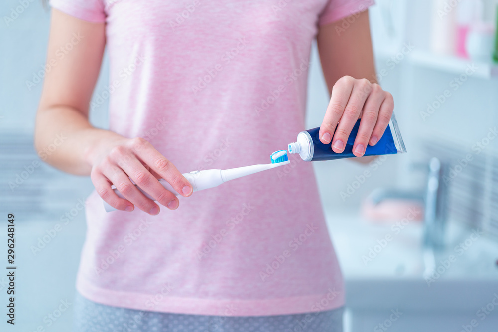 Brushing teeth using ultrasonic electric toothbrush and toothpaste in ...
