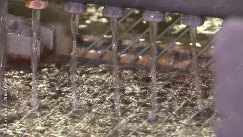 Production of wire by drawing technology. Wires pass through sulfuric ...