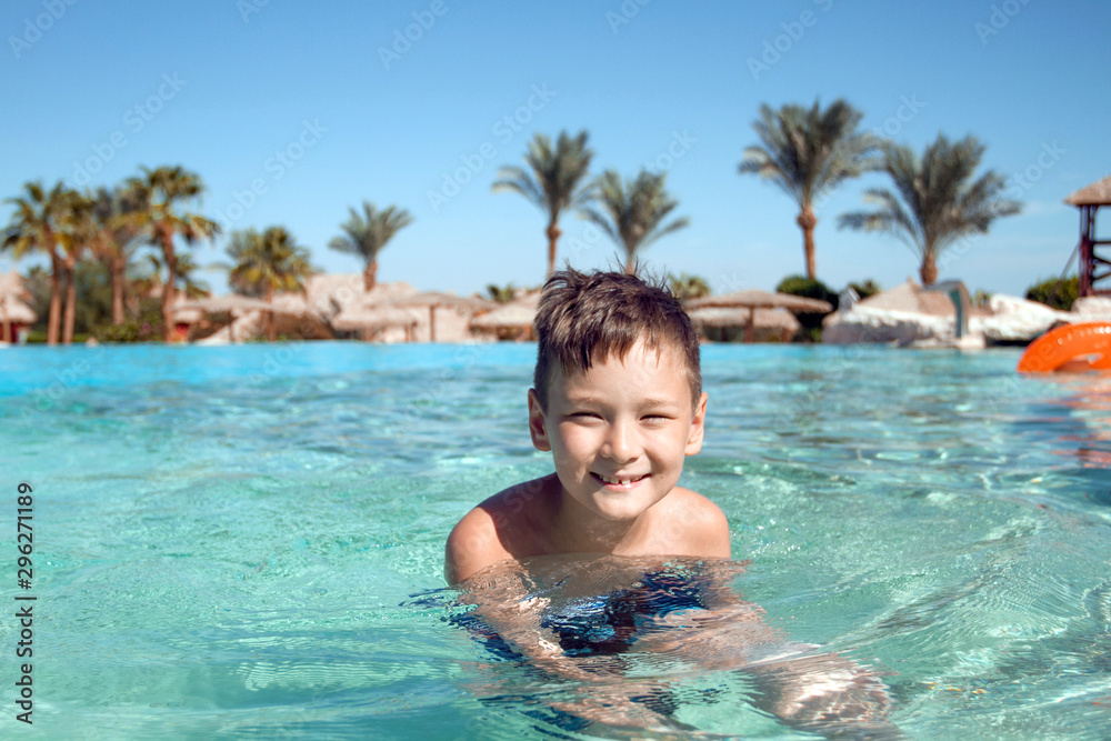 Boy in the swimming pool Stock Photo | Adobe Stock