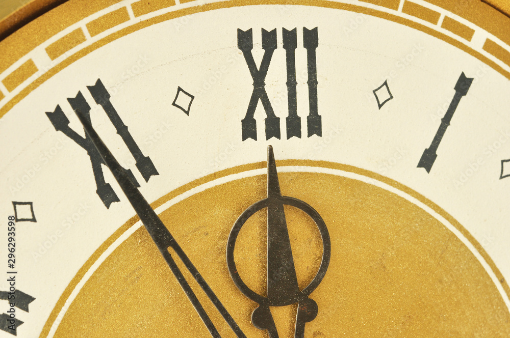 Old clock with roman numerals. Stock Photo | Adobe Stock