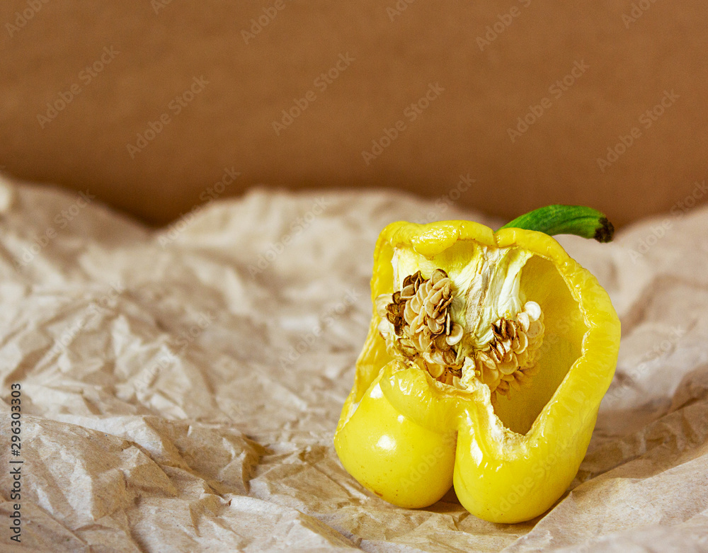 Ugly organic green pepper. A deformed half bell pepper with an old ...
