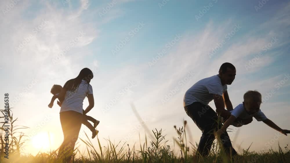 happy family teamwork a mom and daddy is circling a little daughters ...
