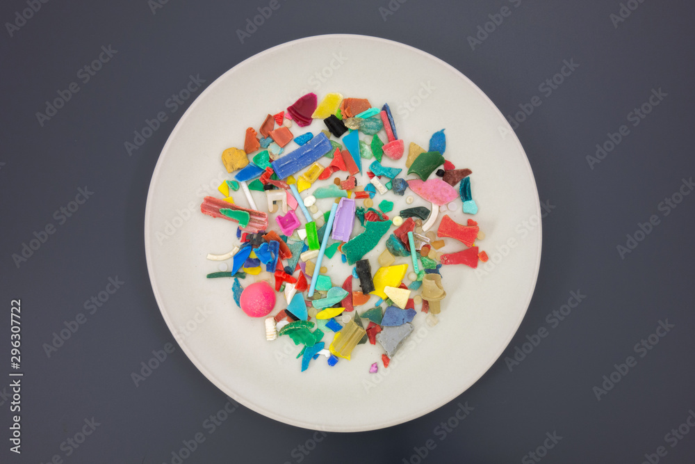 Plate full of microplastics. Plastic pollution concept. Stock Photo ...