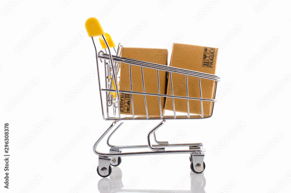 Paper boxes in a trolley on white background. Ideas online shopping is ...