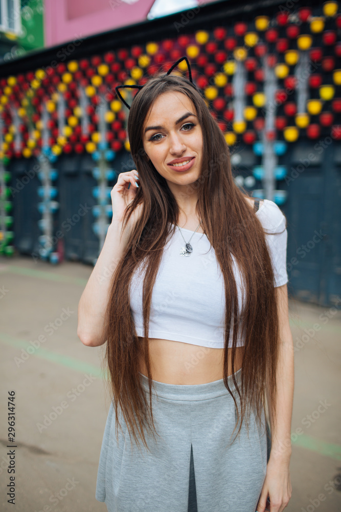 very cute young girl posing as top models on a street in Europe on ...
