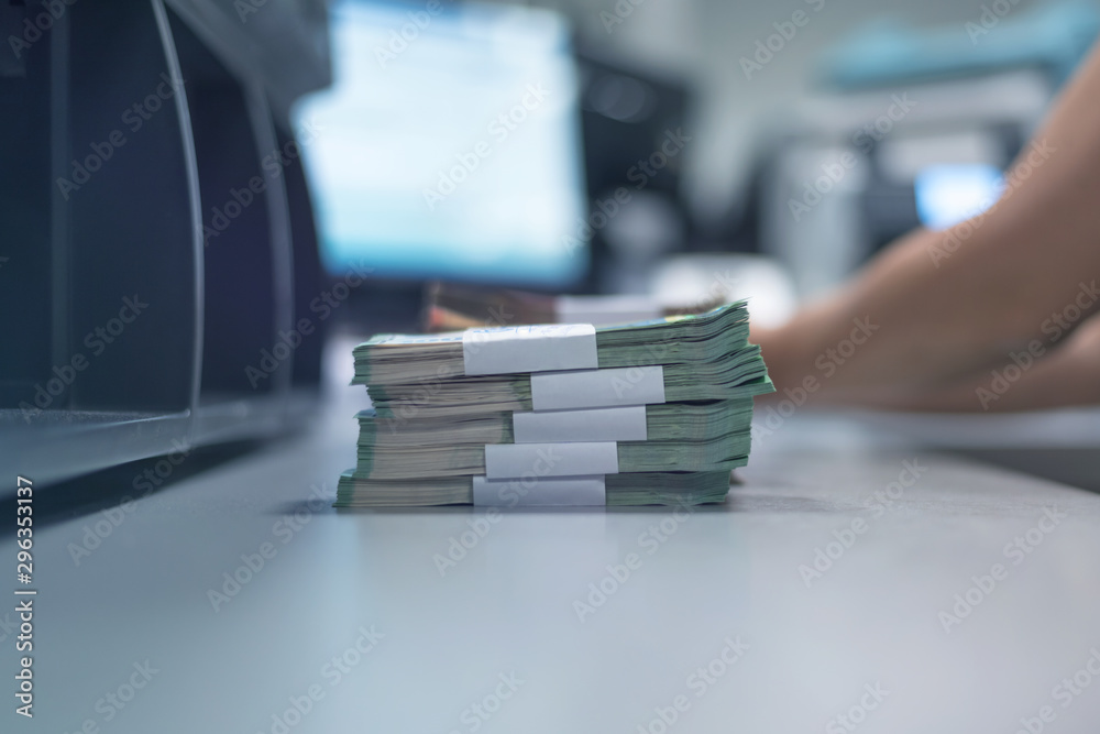 Bank employees sorting and counting money inside bank vault. Stock ...