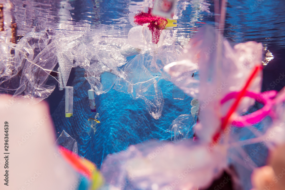 Plastic waste floating in water Stock Photo | Adobe Stock