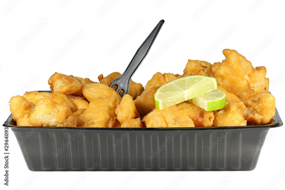 Kibbeling in a plastic tray isolated on white background. Kibbeling is ...