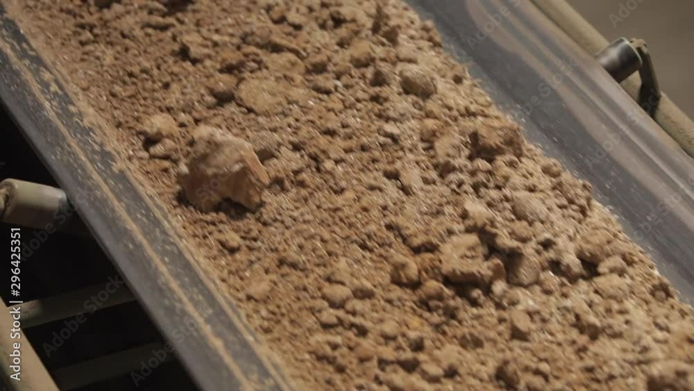 Machines working and conveyor line transporting sand. Conveyor belt on ...