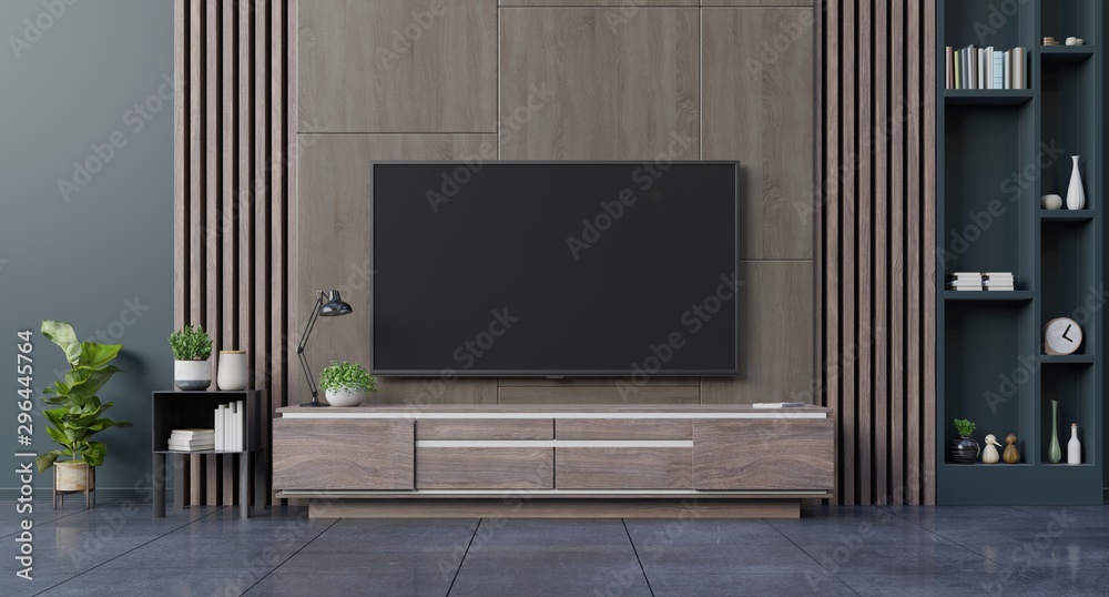 TV on cabinet in modern living room with lamp,table,flower and plant on ...