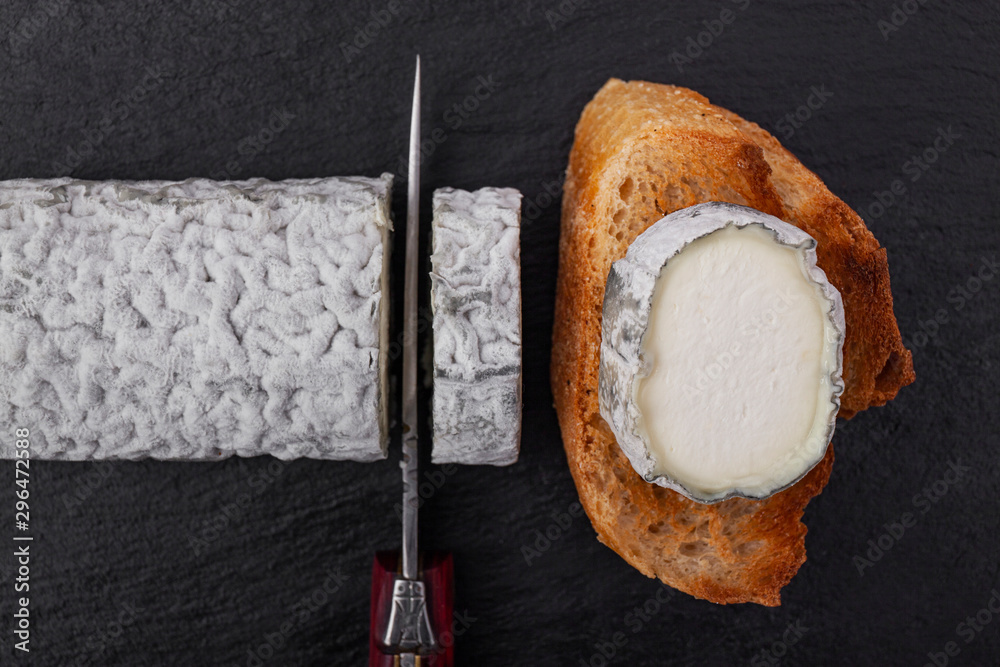 french goat's milk cheese shaped like a log with a toast Stock Photo ...