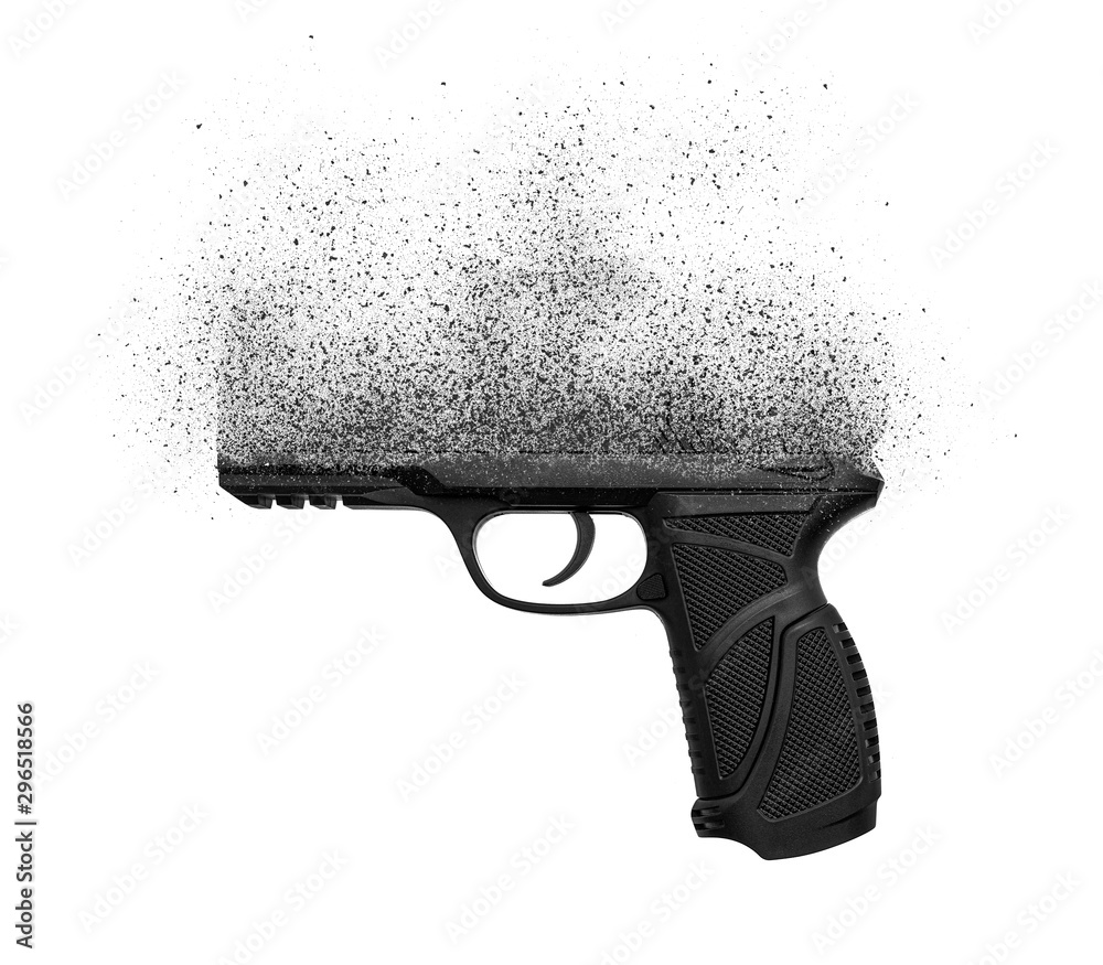 A gun crumbling into particles in space isolate on a white background ...