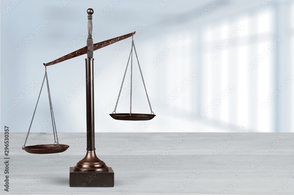 Law scales on table background. Symbol of justice Stock Photo | Adobe Stock