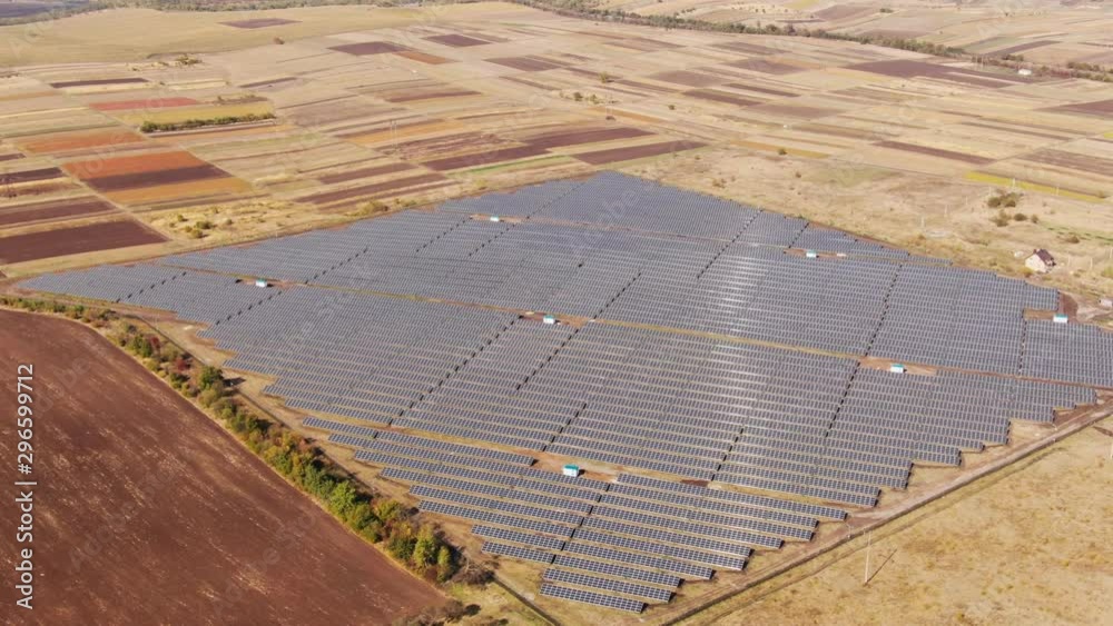 Zoom aerial view of Solar Panels Farm (solar cell) with sunlight. Drone ...