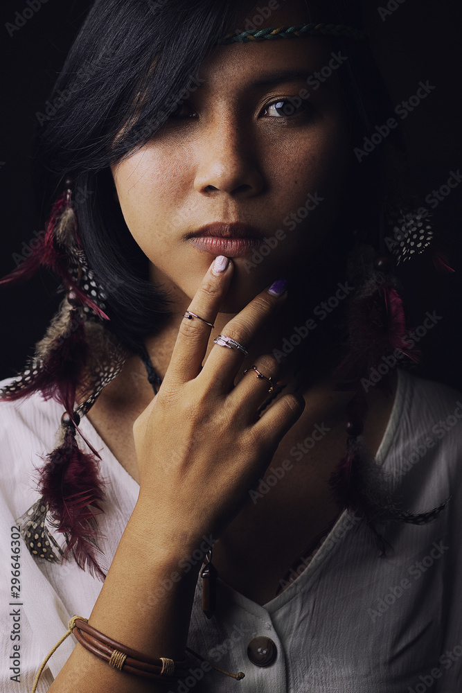 Native American woman's face With freckles on the face And jewelry made ...