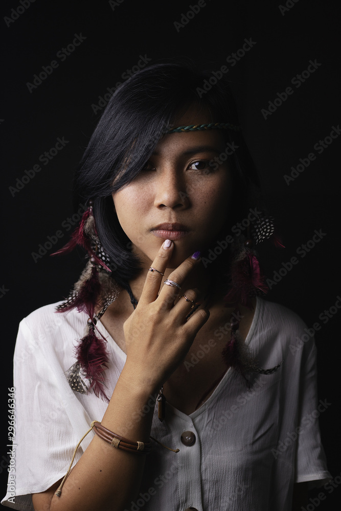 Native American woman's face With freckles on the face And jewelry made ...
