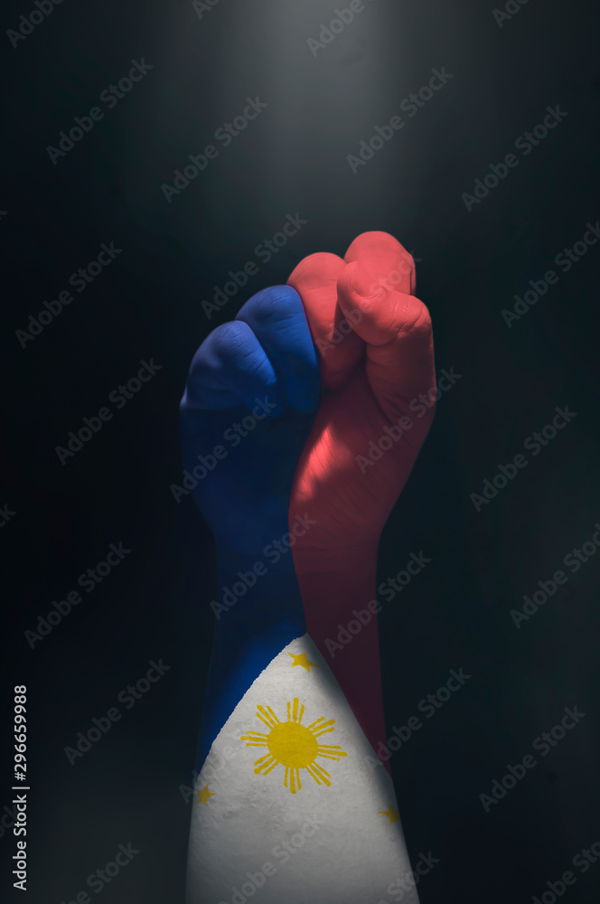 Raised fist of a Philippine flag. Filipino hand showing a symbol of ...