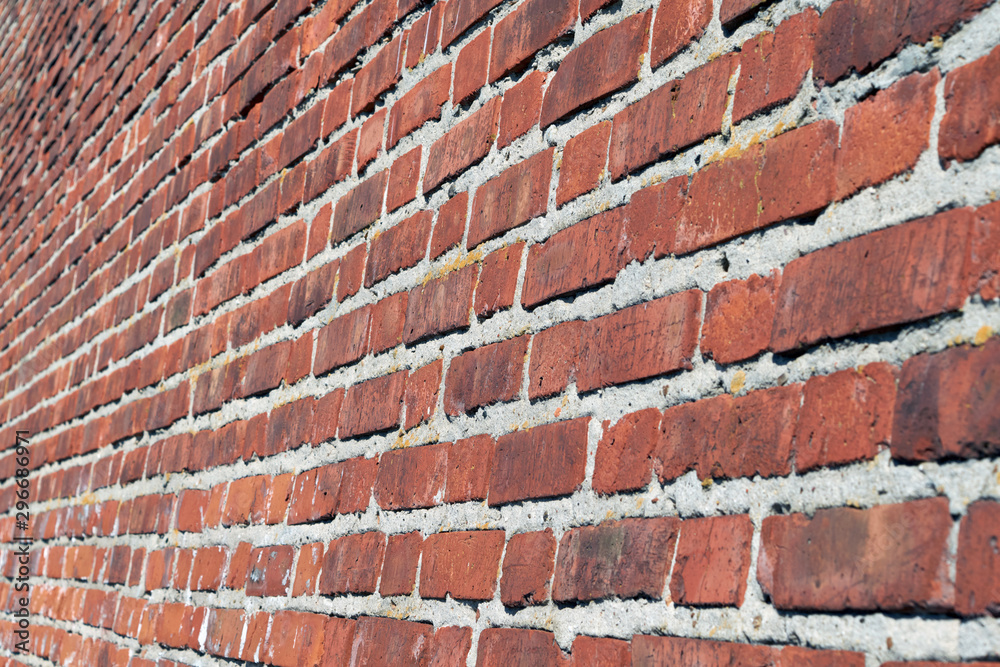Large red brick wall. Side view. Perspective. The surface of the wall ...