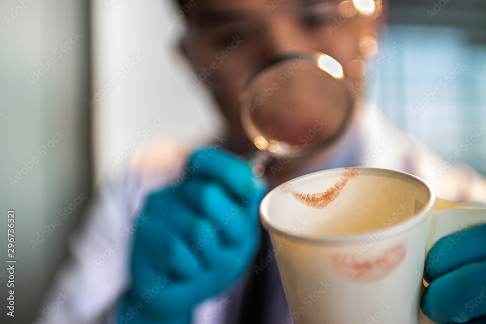 investigation crime science concept.Forensic science. Use a magnifying ...