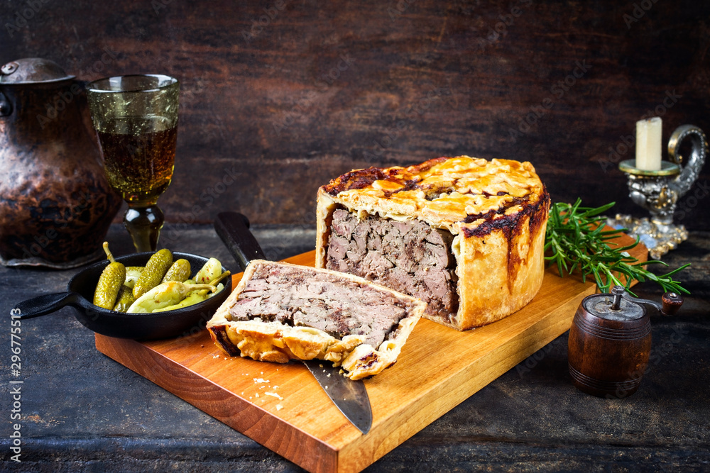 Traditional French Pate en croute with goose liver as closeup with ...