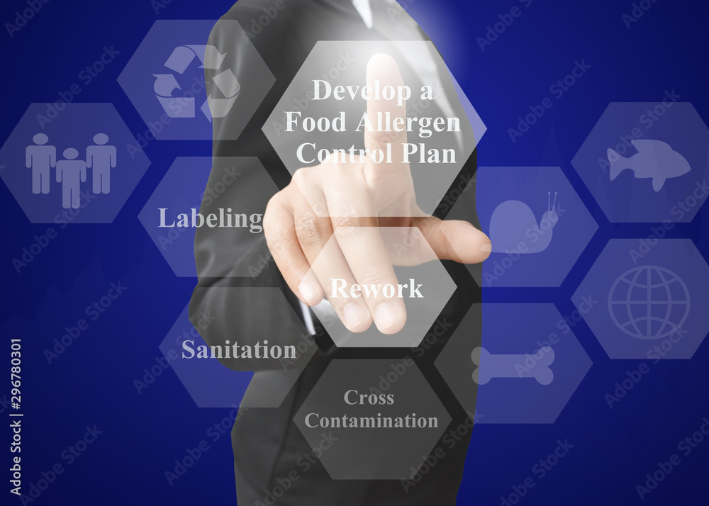 Business woman showing presentation of develop a food allergen control ...