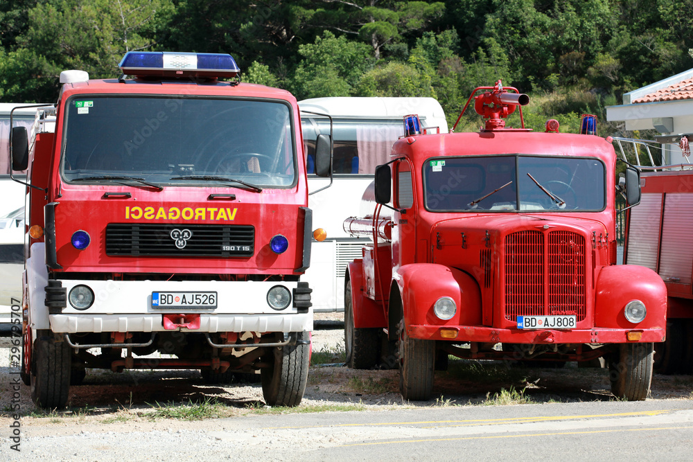 PETROVAC, MONTENEGRO - JUNE 26, 2013: Photo of red firefighters trucks ...