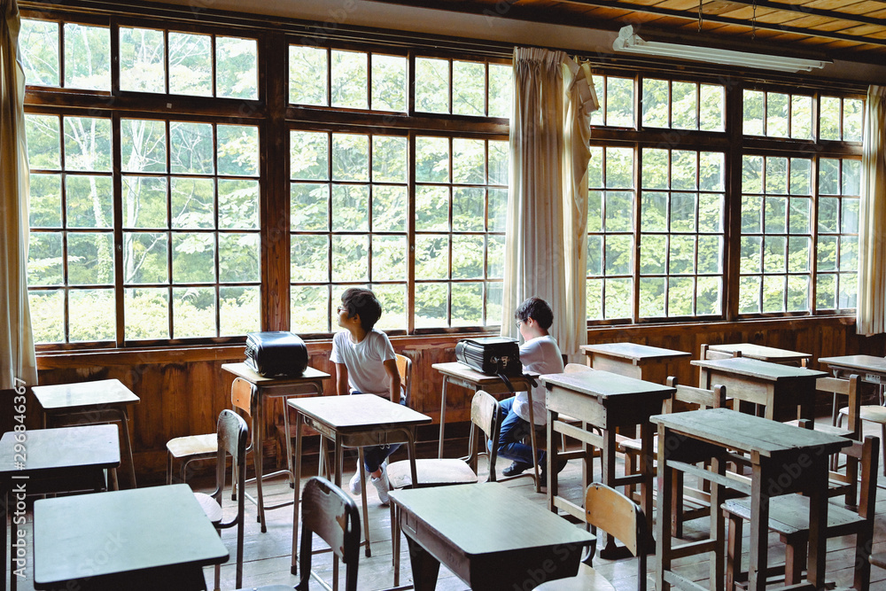 Students with school bags in classroom Stock Photo | Adobe Stock