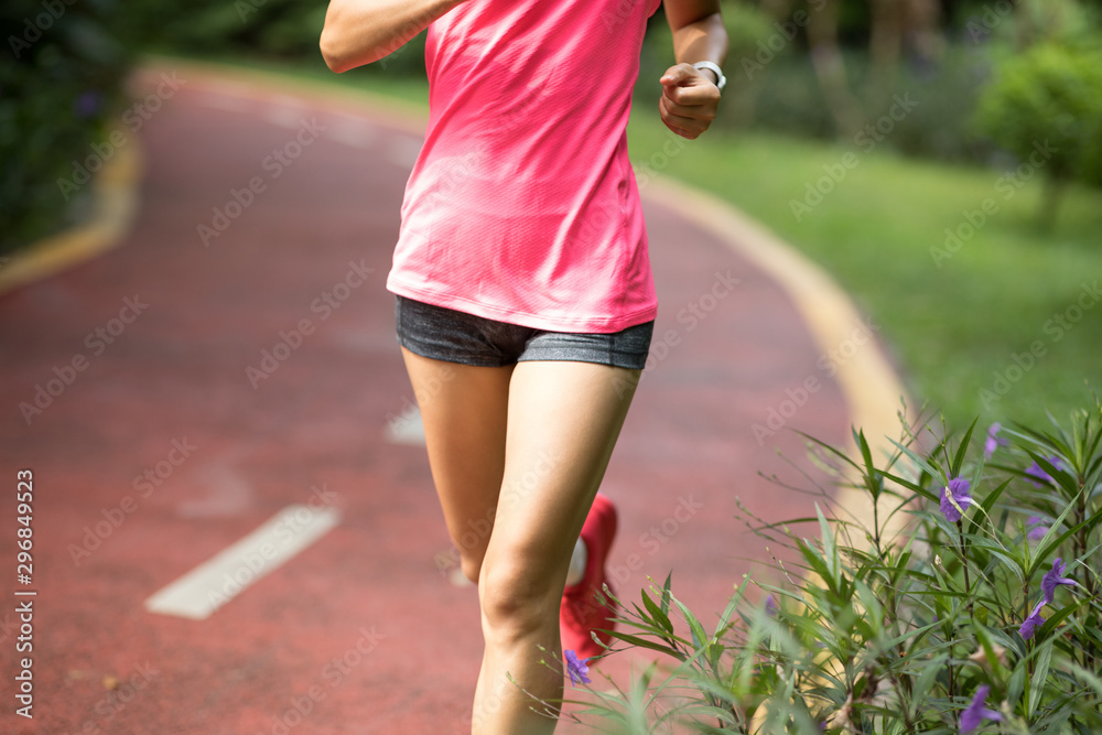 Female runner running on park trail . Healthy fitness woman jogging ...
