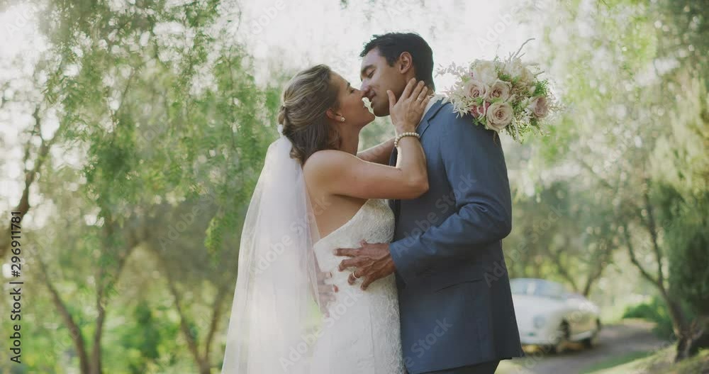 Passionate diverse couple embracing and kissing in nature on their ...