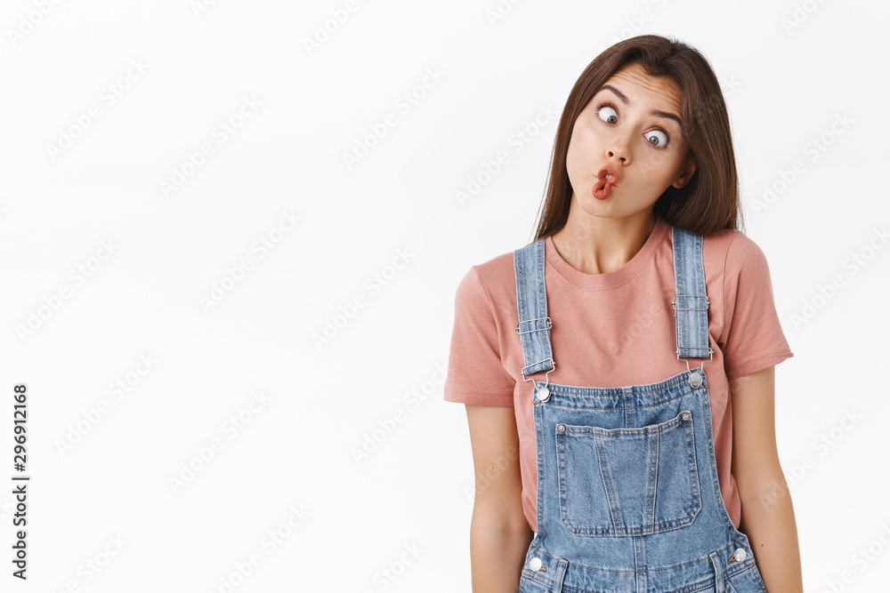 Funny and cute silly woman making crazy weird faces, grimacing, folding ...