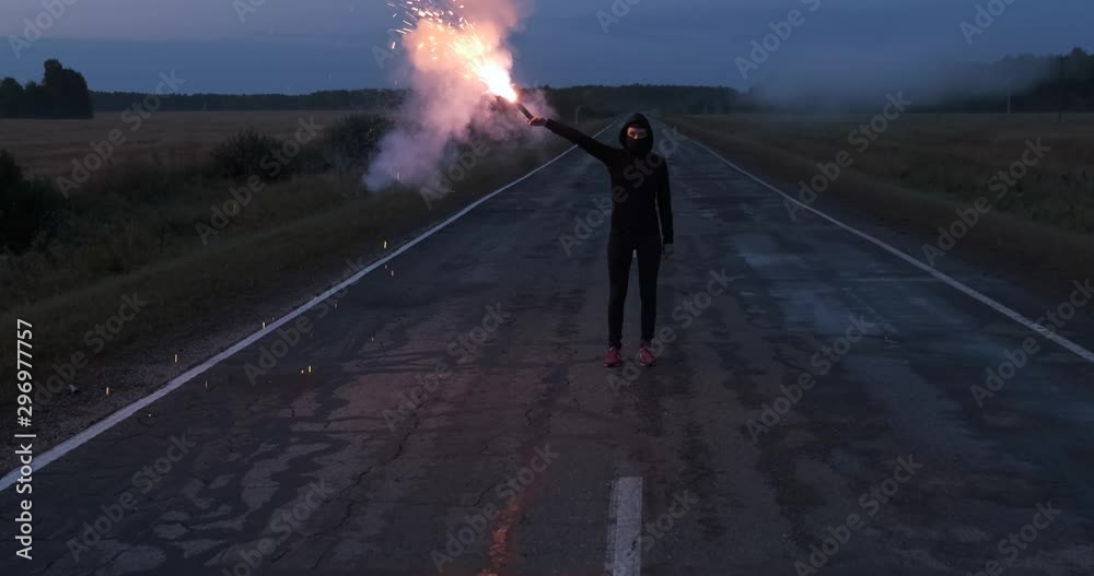 First man ready to resist, lit fire, determined look, readiness for ...