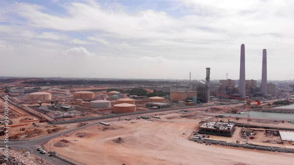 Aerial footage over Fuel reservoirs with Chimneys in the Middle east ...