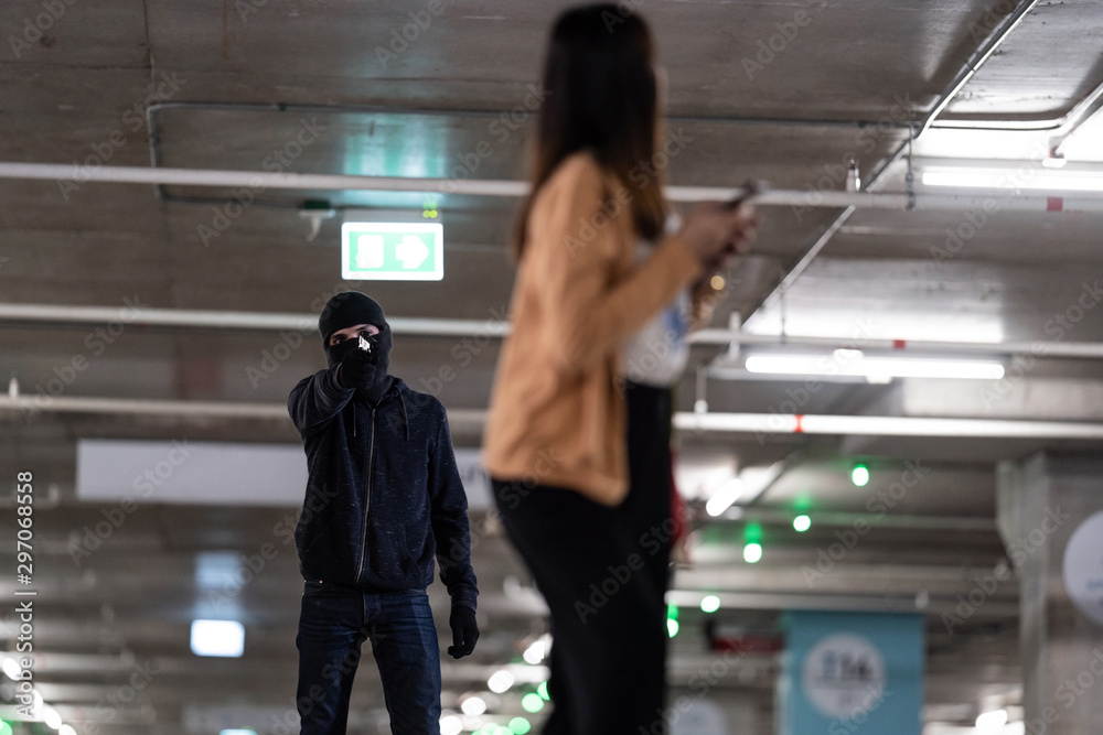 Robber lonely woman In the dark and dangerous.The robber threatened her ...