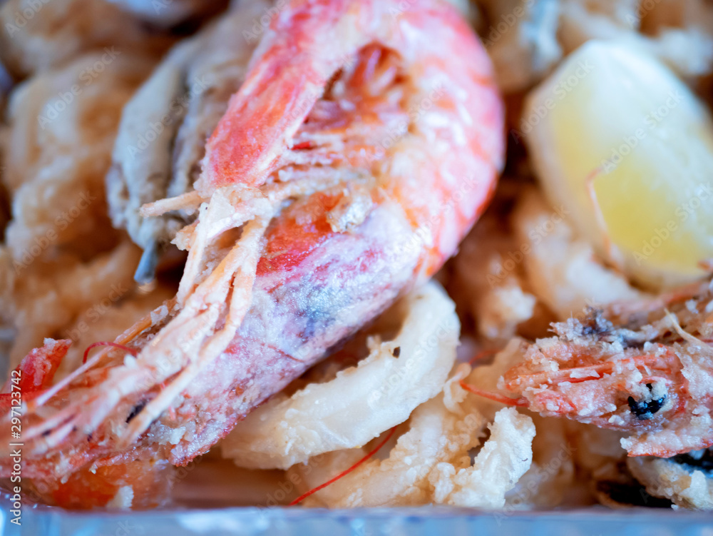 Typical Italian dish, mixed fried fresh fish with squid rings, sardines ...