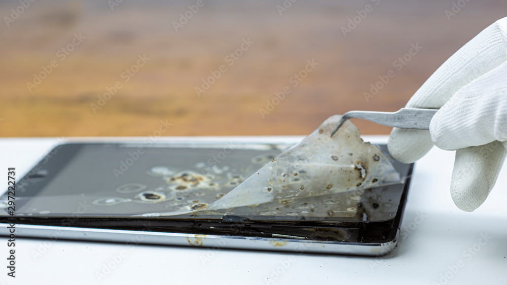 Damaged exploded tablet by overcharging, investigate by specialist ...