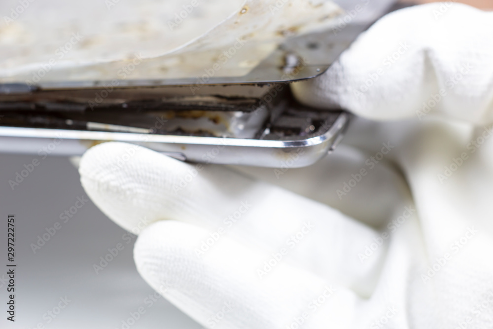 Damaged exploded tablet by overcharging, investigate by specialist ...