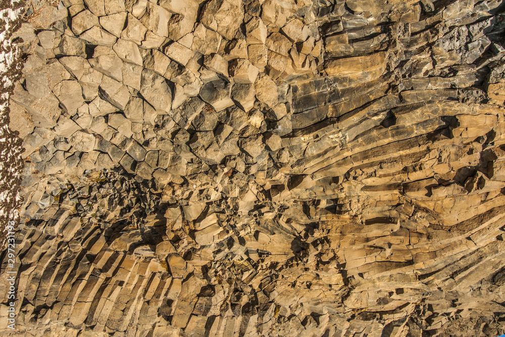 Basalt rock formations and lava columns and arches of Hjálparfoss ...
